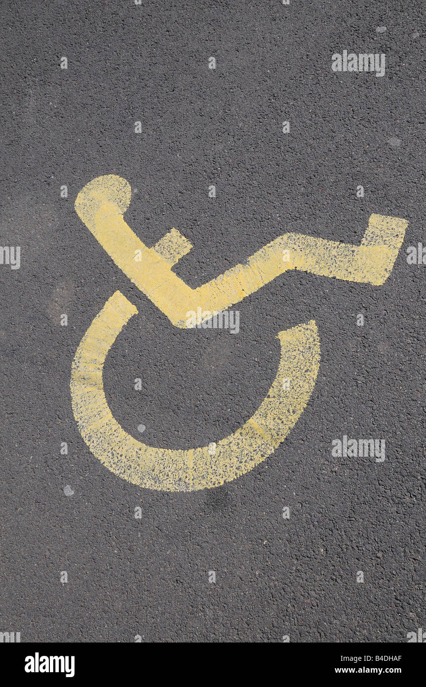 Disabled symbol painted on tarmac in a carpark to show a designated ...