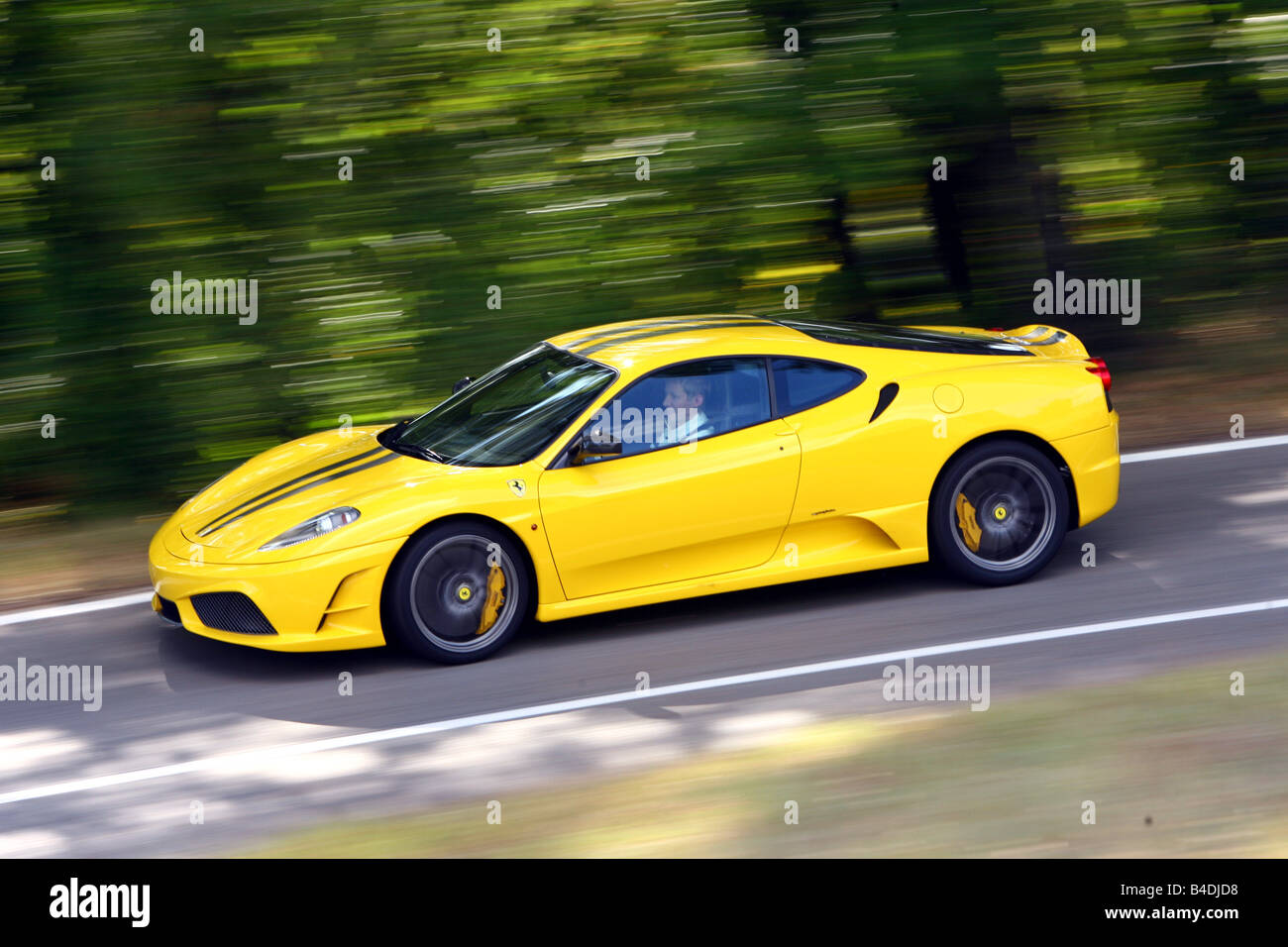Ferrari 430 Scuderia, model year 2007-, yellow, driving, side view ...