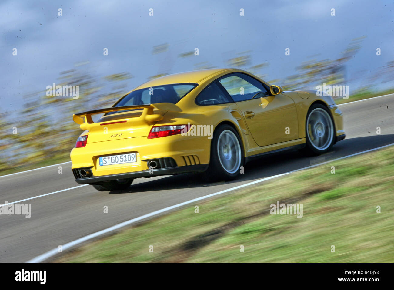 Porsche 911 GT2, model year 2007-, yellow, driving, moving, diagonal ...
