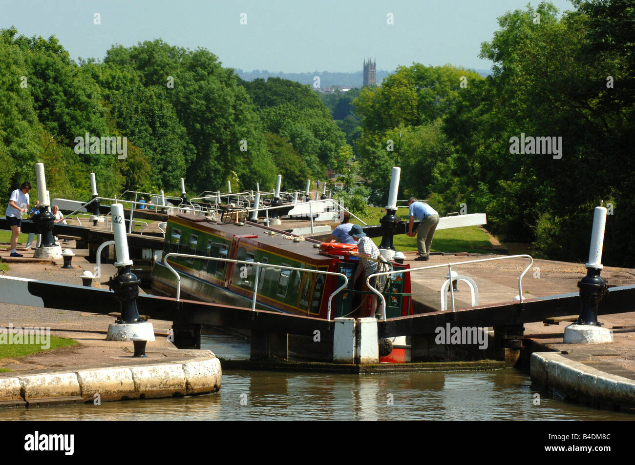 Boat negotiating the flight of locks at Hatton Warwickshire with St ...