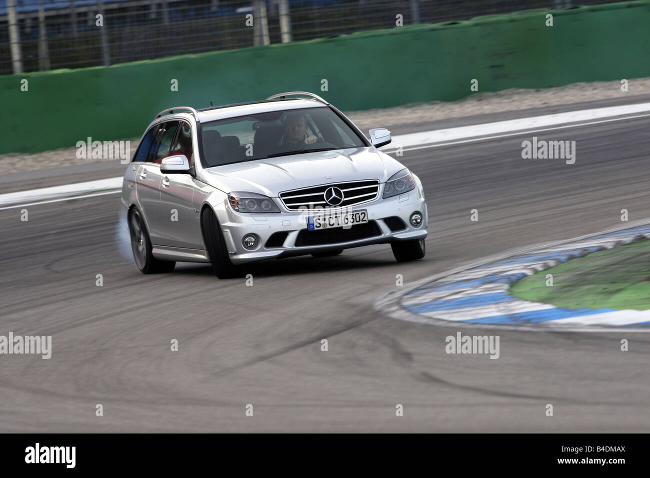Mercedes C 63 AMG, model year 2008-, silver, driving, diagonal from the ...
