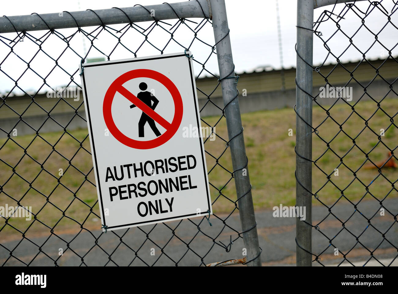 "Authorised Personnel Only" sign on gate Stock Photo - Alamy