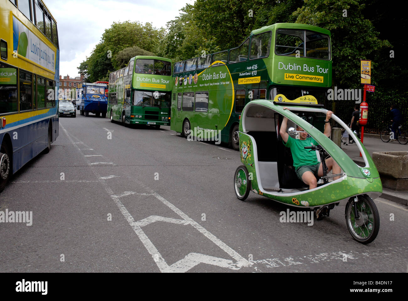 Green Eco Cab and Dublin Bus Tour Dublin Ireland Stock Photo - Alamy