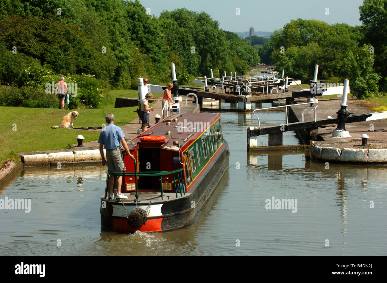 Boat negotiating the flight of locks at Hatton Warwickshire with St ...
