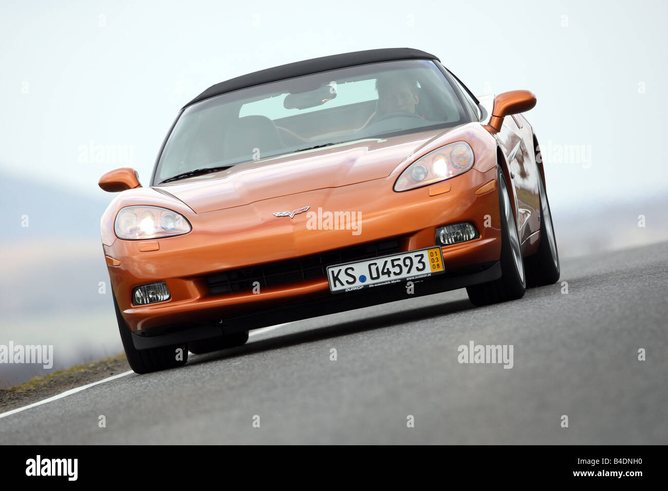Corvette C6, rust-red model year 2008, orange -metallic, driving ...