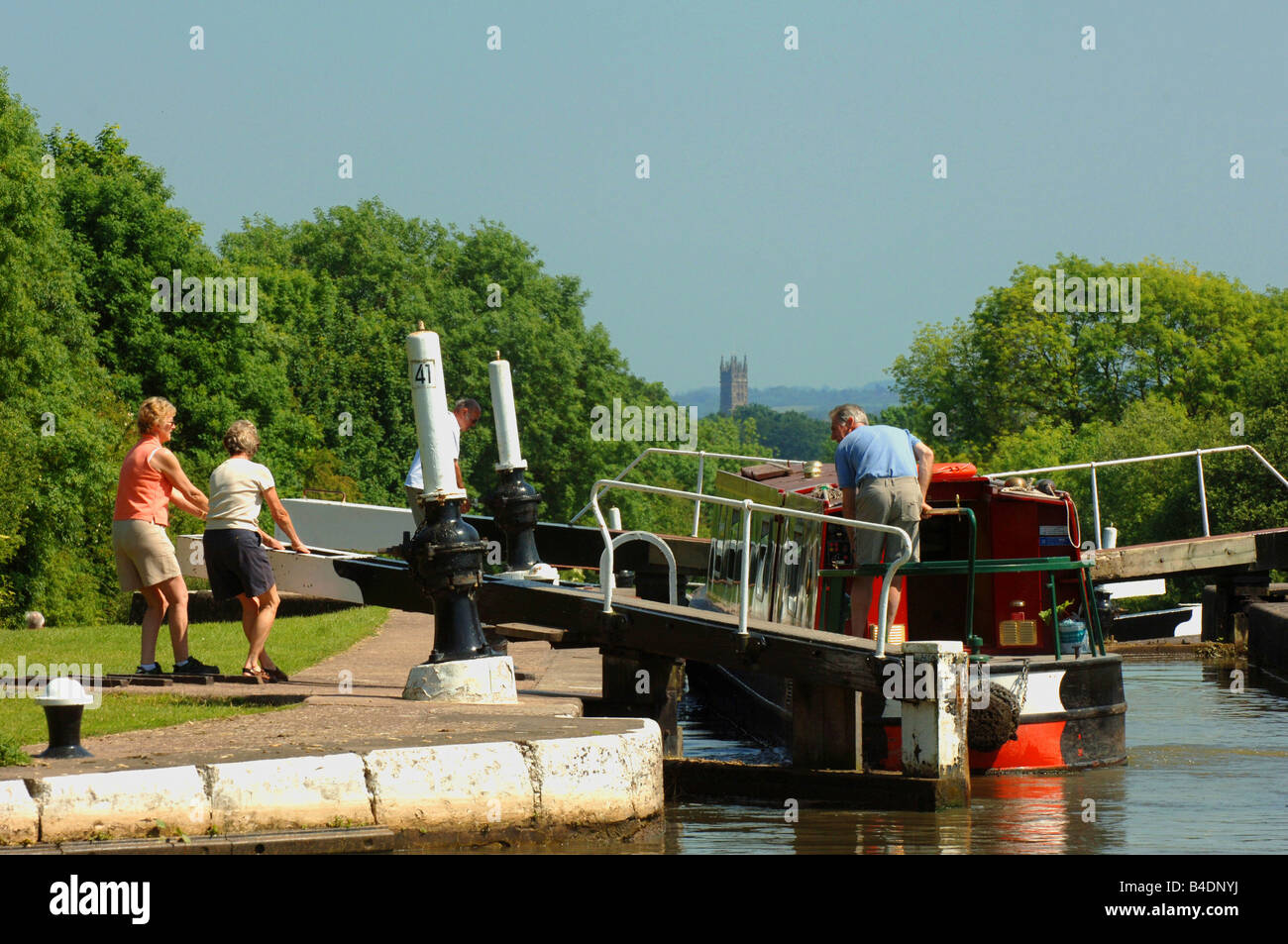 Boat negotiating the flight of locks at Hatton Warwickshire with St ...