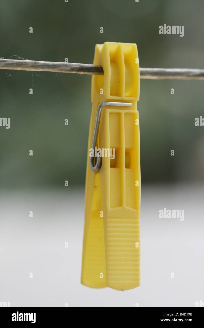 yellow peg on wire with defocus green and white background Stock Photo ...