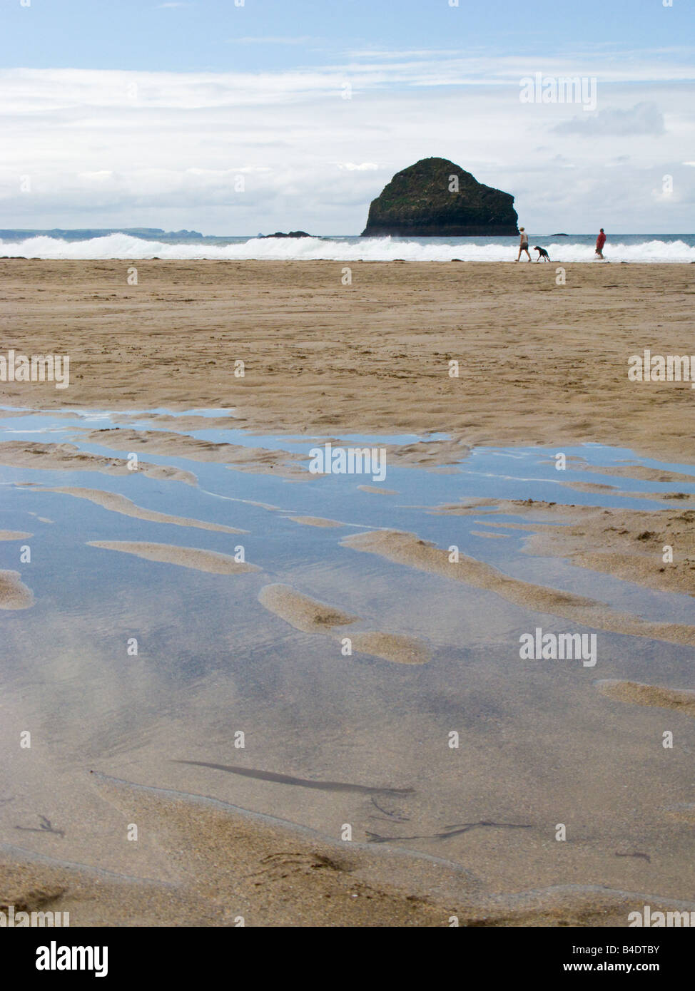 On the beach at Trebarwith Strand Cornwall with Gull Rock in he ...