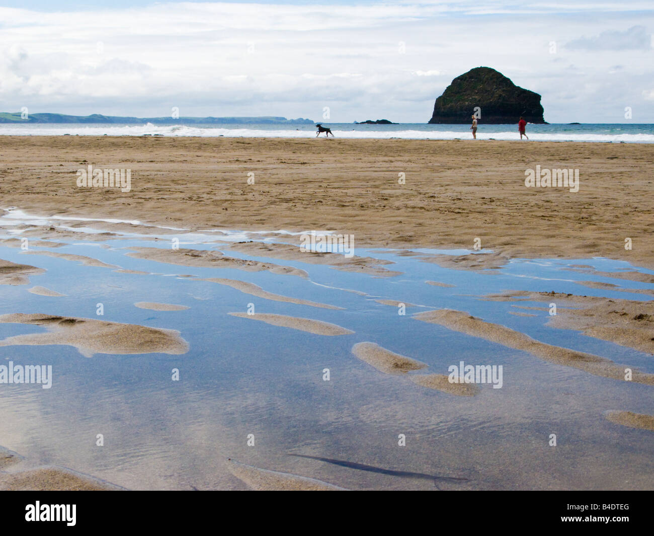 On the beach at Trebarwith Strand Cornwall with Gull Rock in he ...