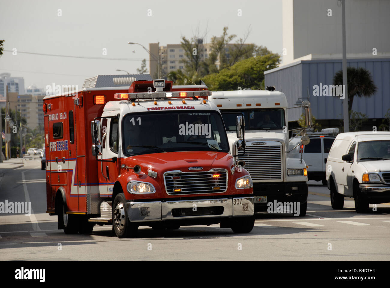 Emergency vehicle rushing to accident site Stock Photo - Alamy
