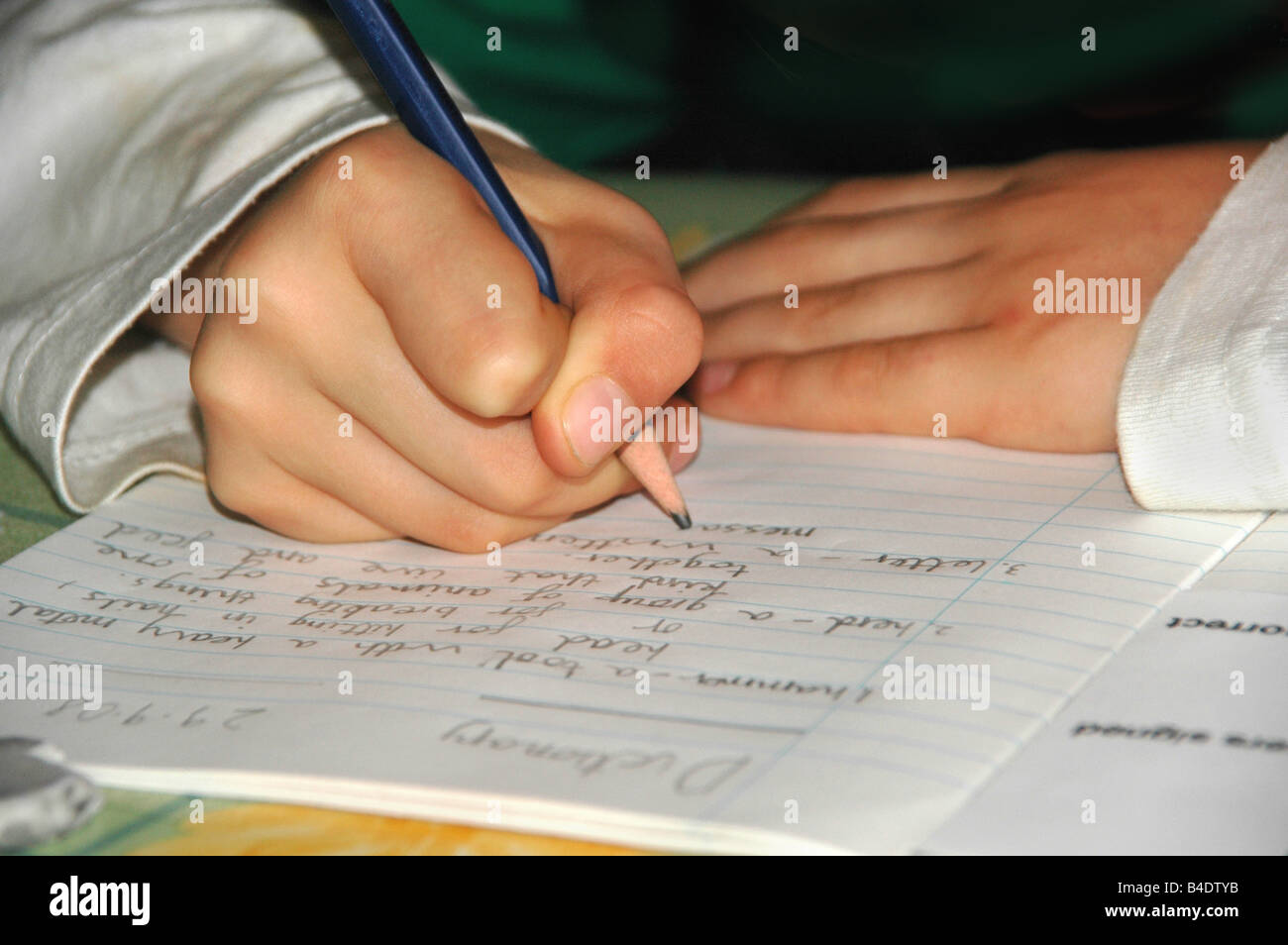 A young boy working on his homework Stock Photo - Alamy