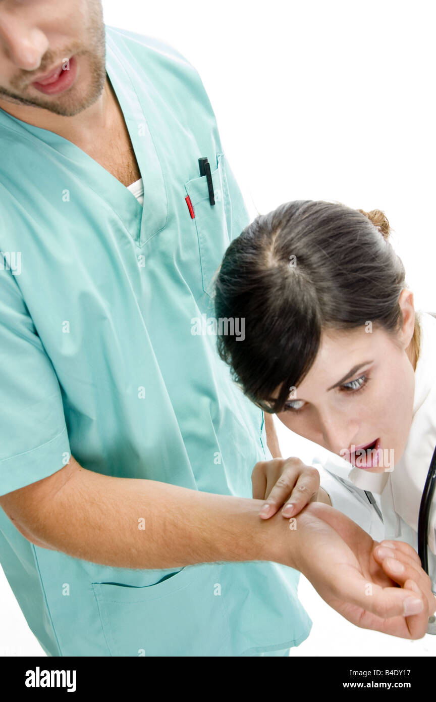 nurse checking pulse of patient Stock Photo - Alamy