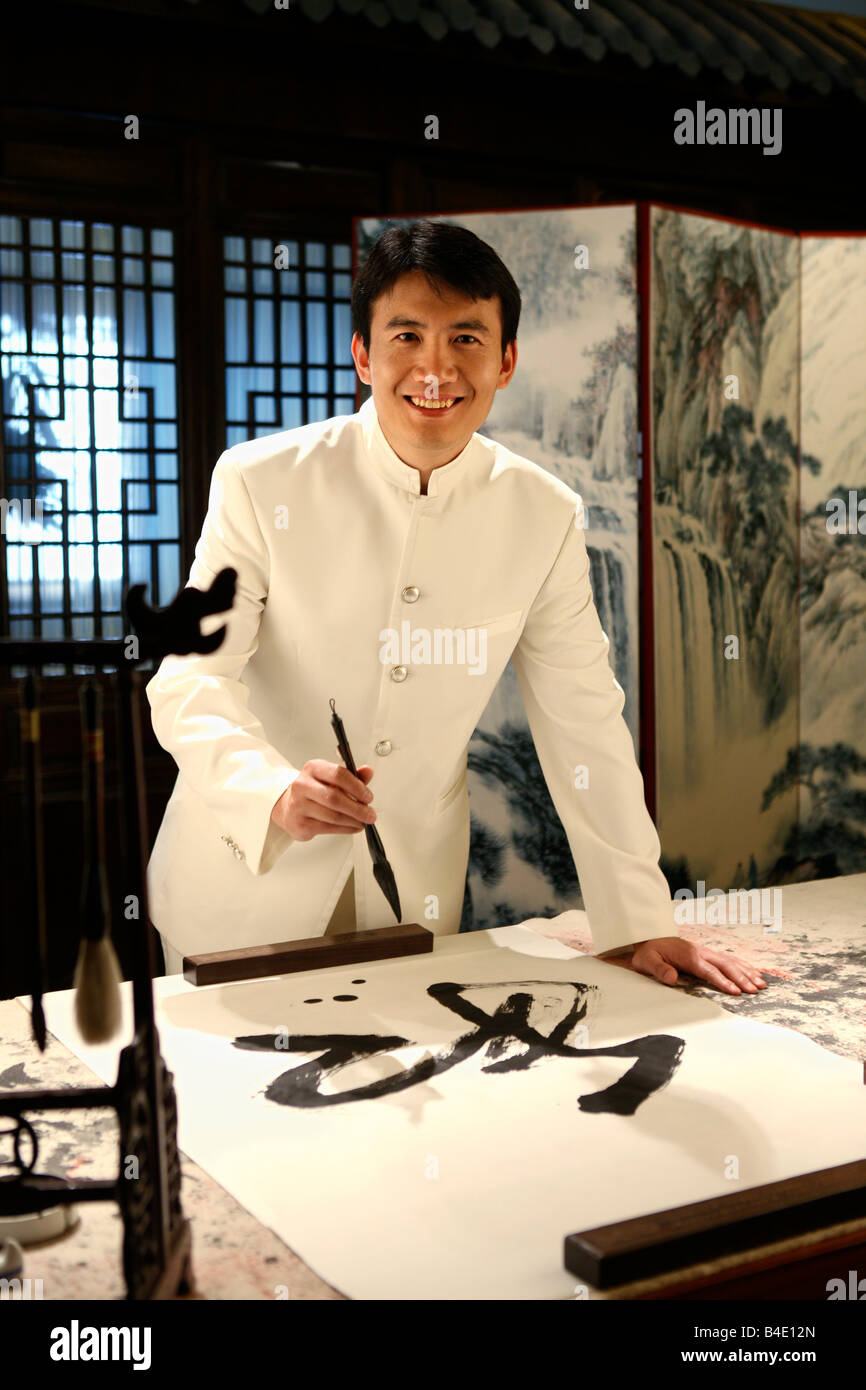 Chinese Man Practising Calligraphy Stock Photo - Alamy