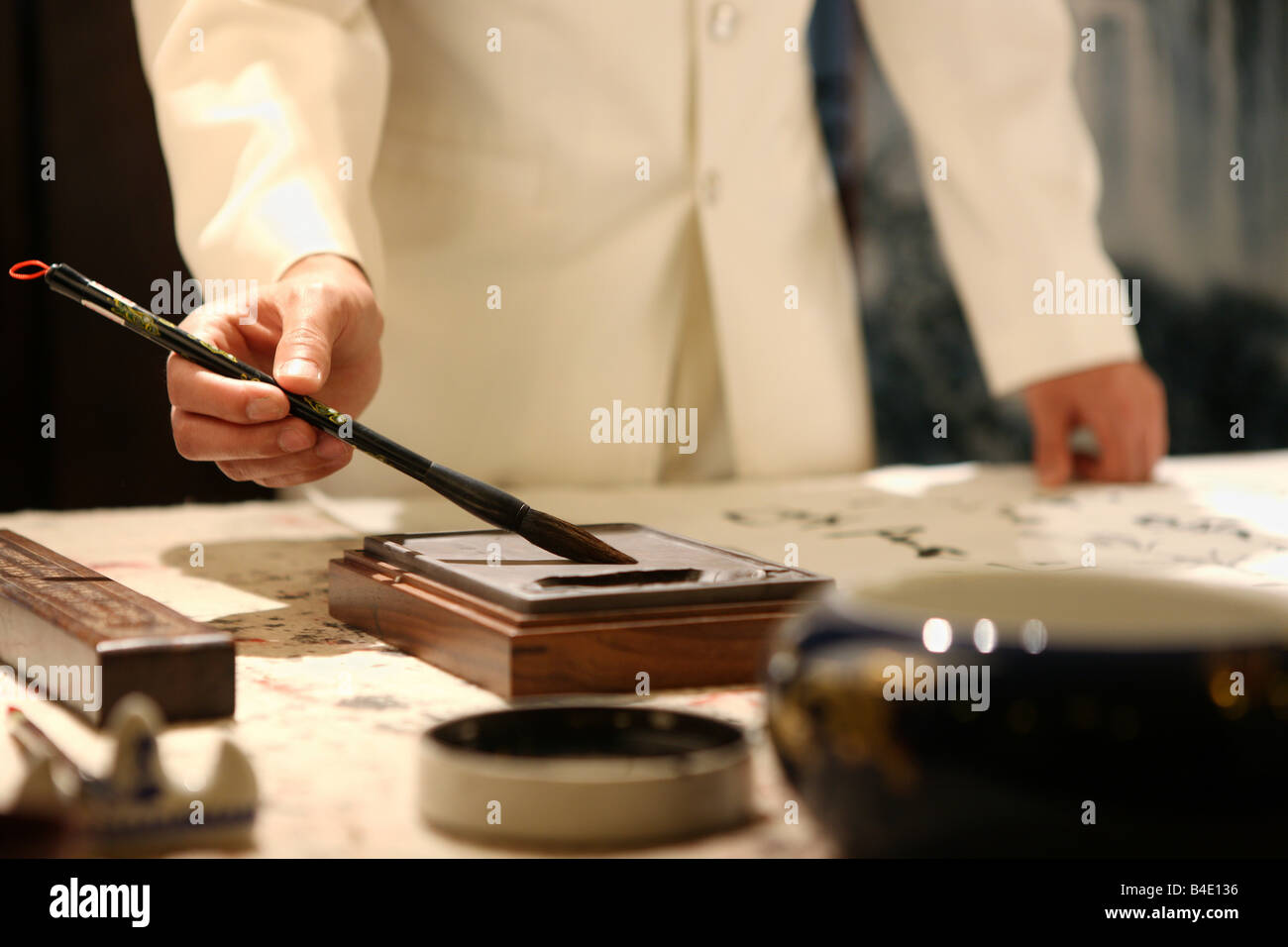 Chinese Man Practising Calligraphy Stock Photo - Alamy