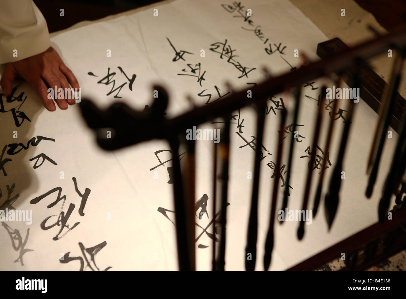 Chinese Man Practising Calligraphy Stock Photo - Alamy
