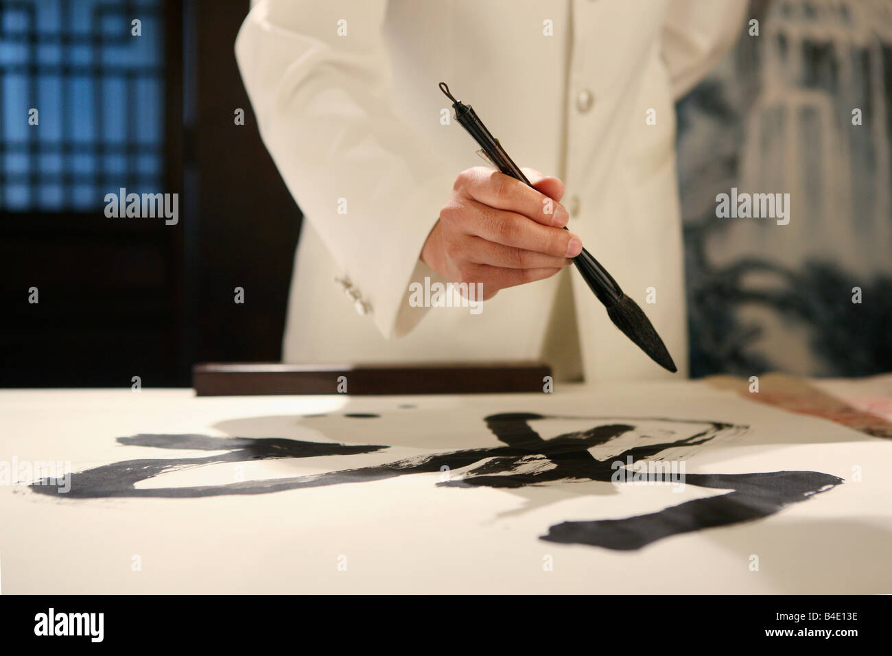 Chinese Man Practising Calligraphy Stock Photo - Alamy