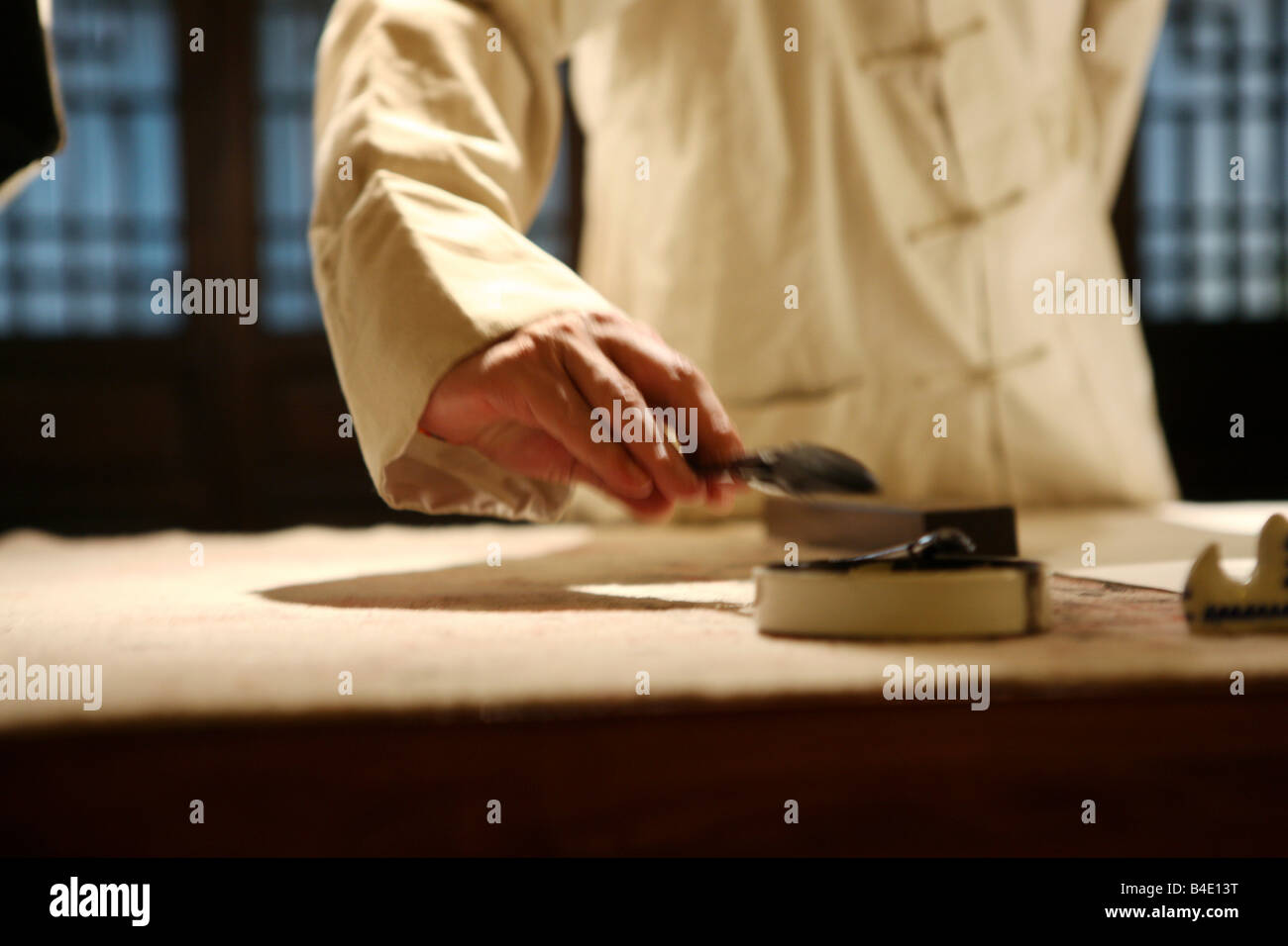 Chinese Man Practising Calligraphy Stock Photo - Alamy
