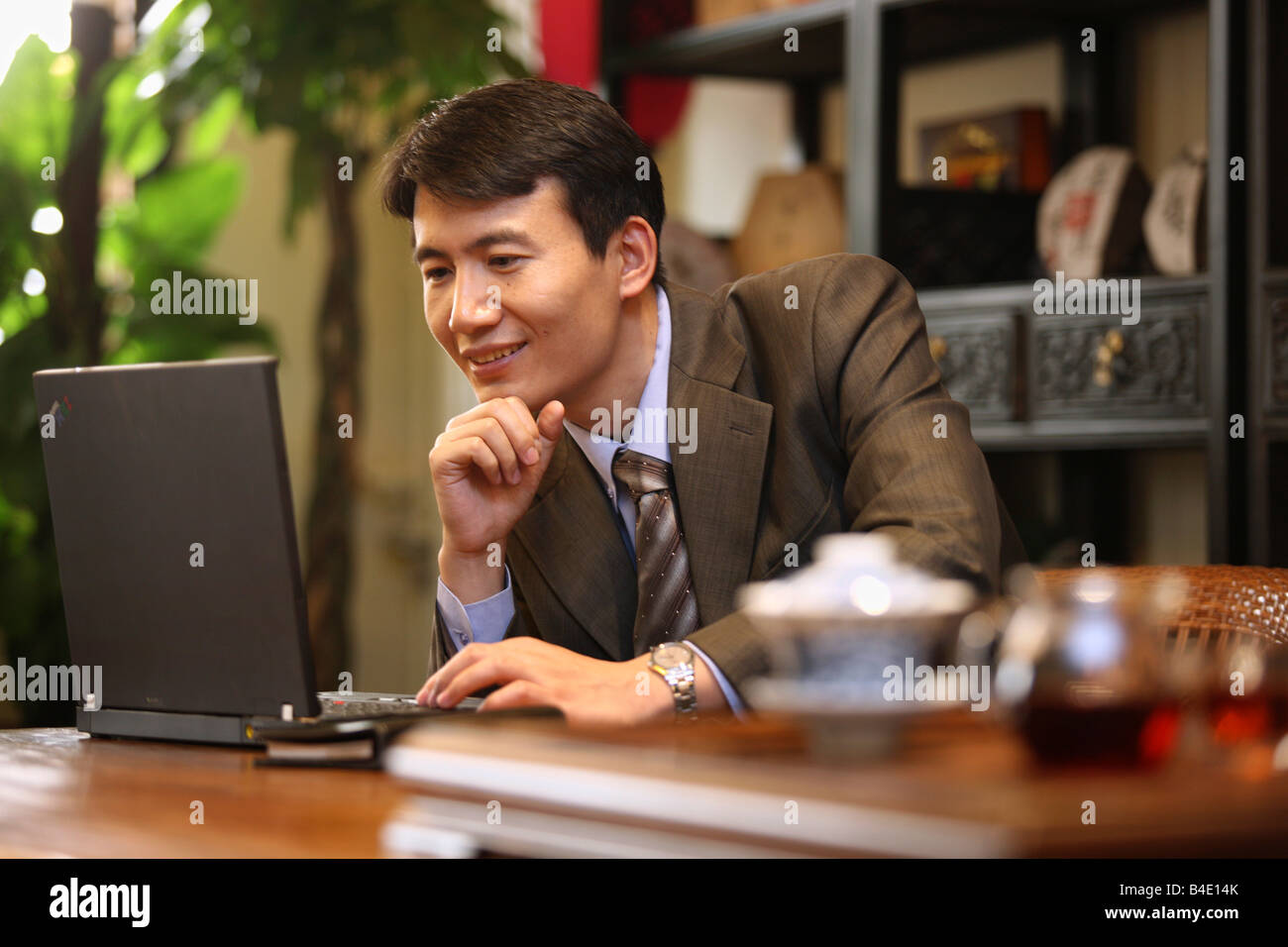 Chinese Business Man Using The Notebook PC Stock Photo - Alamy