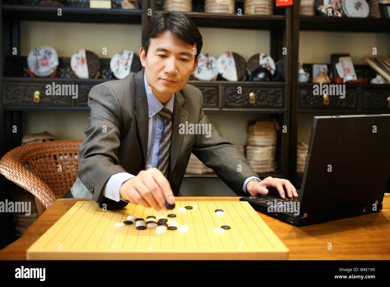 Chinese Business Man Playing Go Stock Photo - Alamy