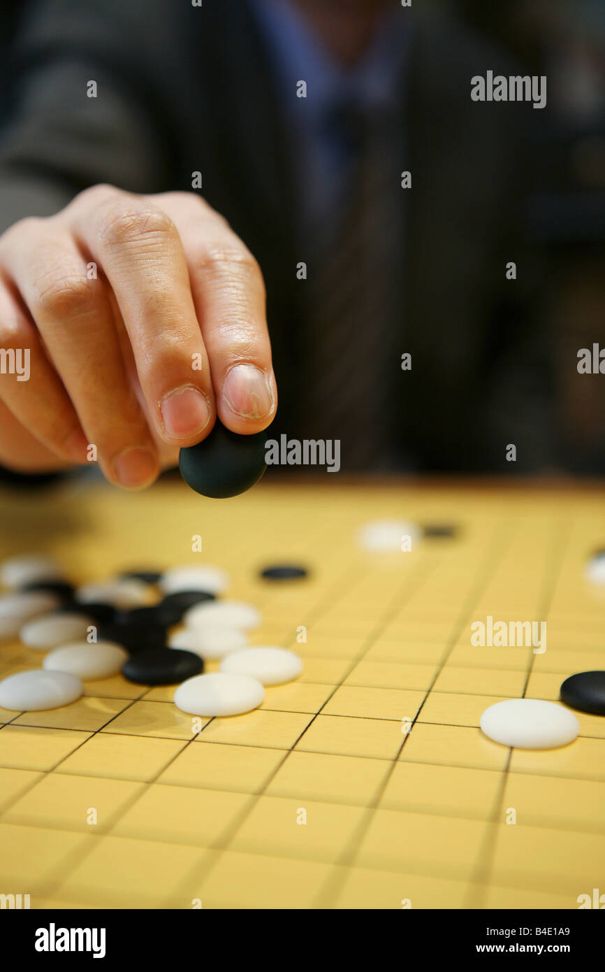 Chinese Business Man Playing Go Stock Photo - Alamy