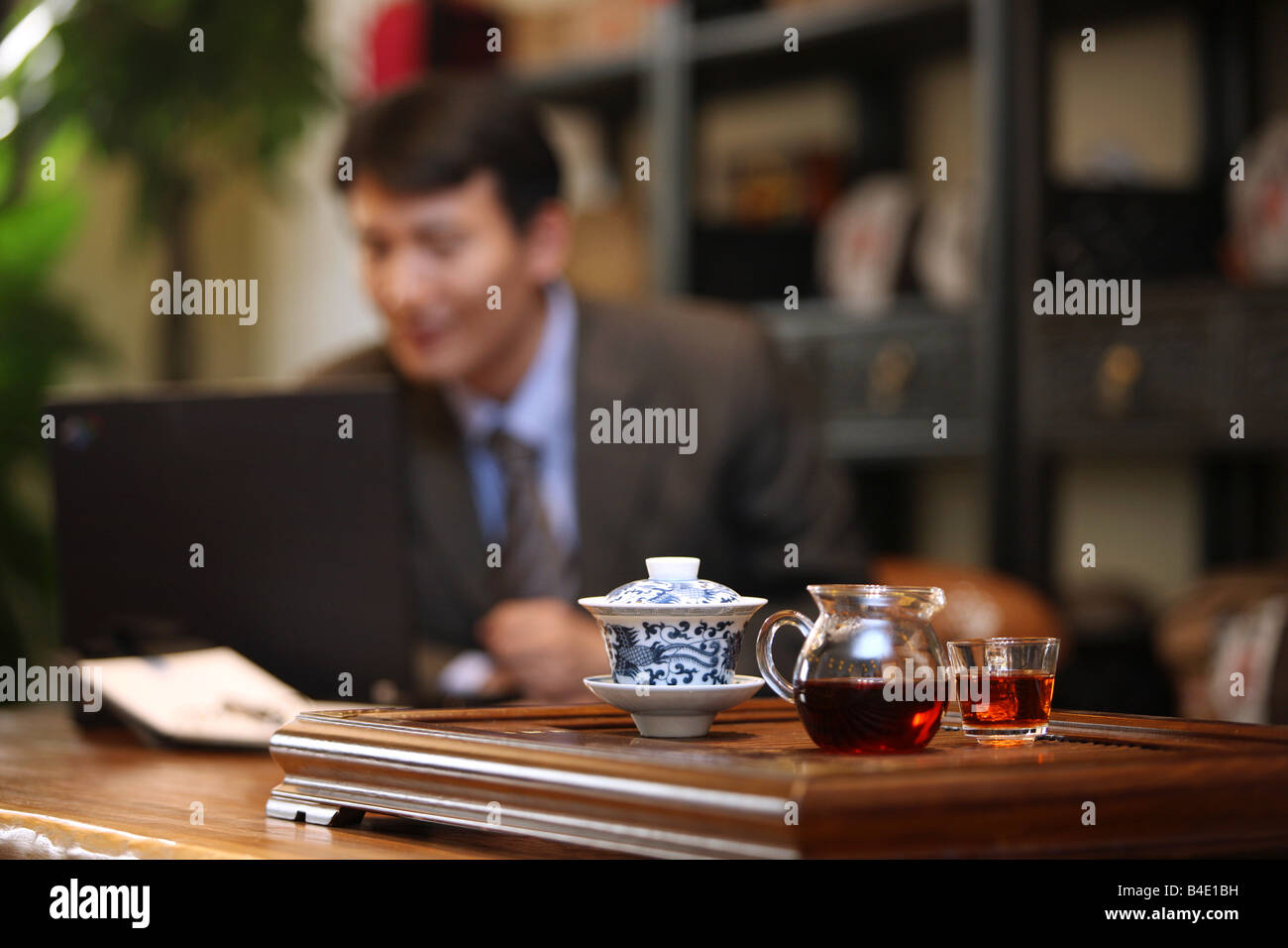 Chinese Business Man Using The Notebook PC Stock Photo - Alamy