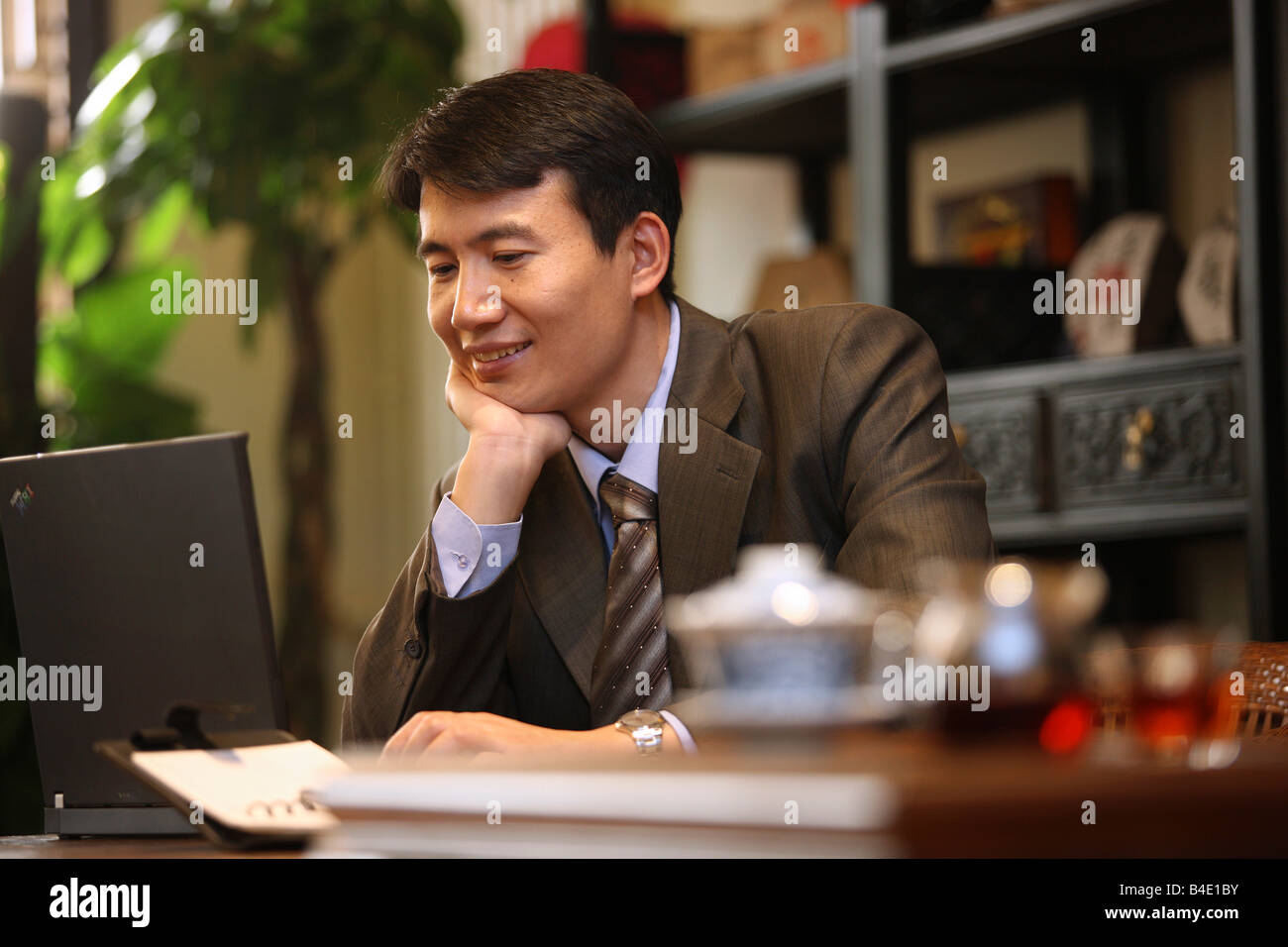 Chinese Business Man Using The Notebook PC Stock Photo - Alamy