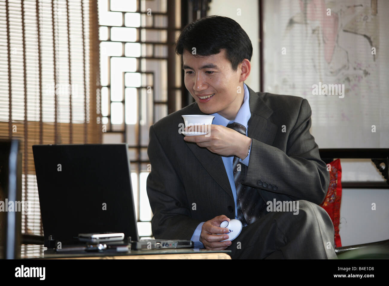 Chinese Business Man Using The Notebook PC Stock Photo - Alamy