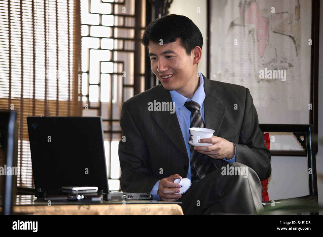 Chinese Business Man Drinking Tea Stock Photo - Alamy