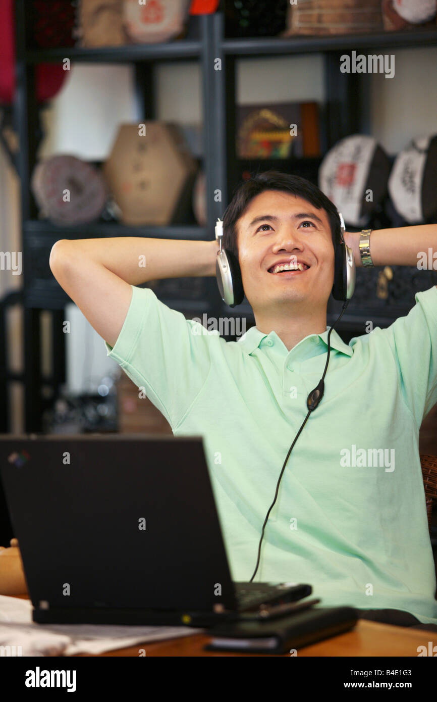 Chinese Man Listening To The Music Stock Photo - Alamy
