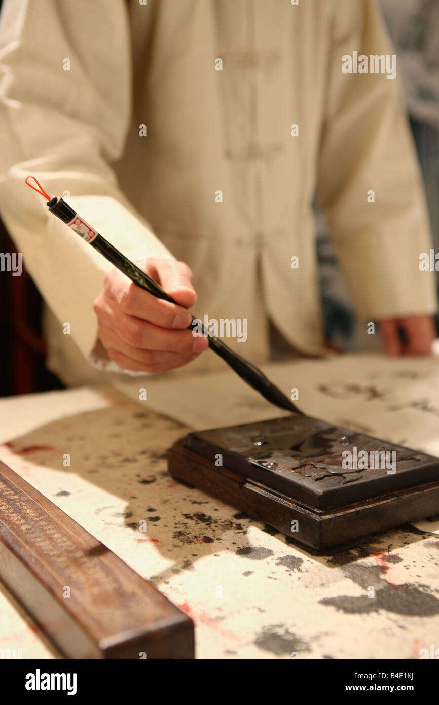 Chinese Man Practising Calligraphy Stock Photo - Alamy