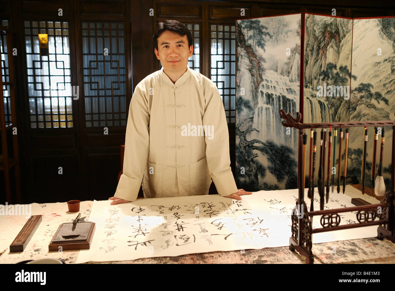 Chinese Man Practising Calligraphy Stock Photo - Alamy