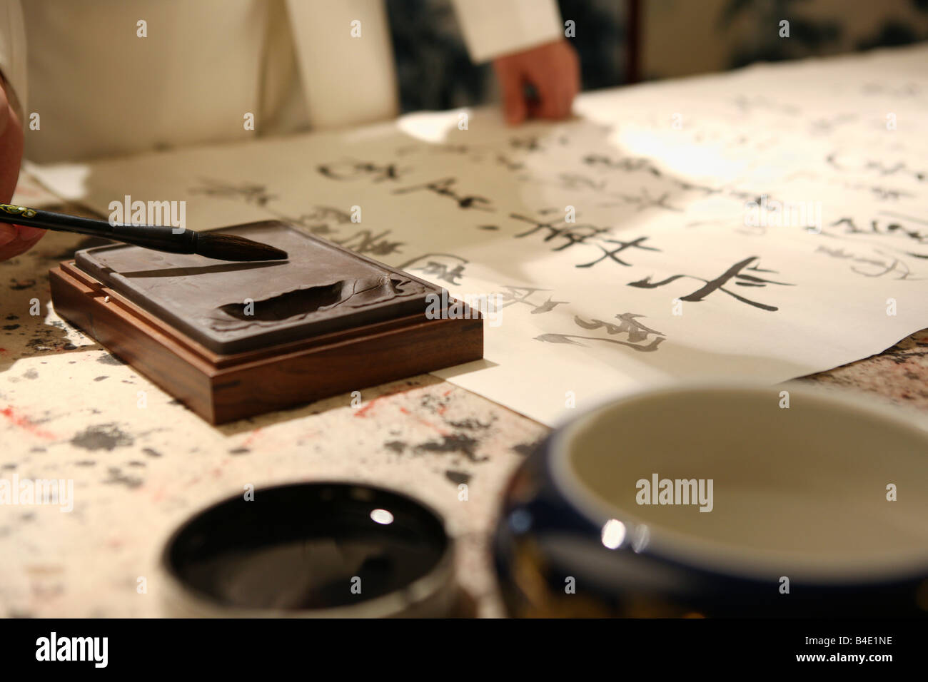 Chinese Man Practising Calligraphy Stock Photo - Alamy