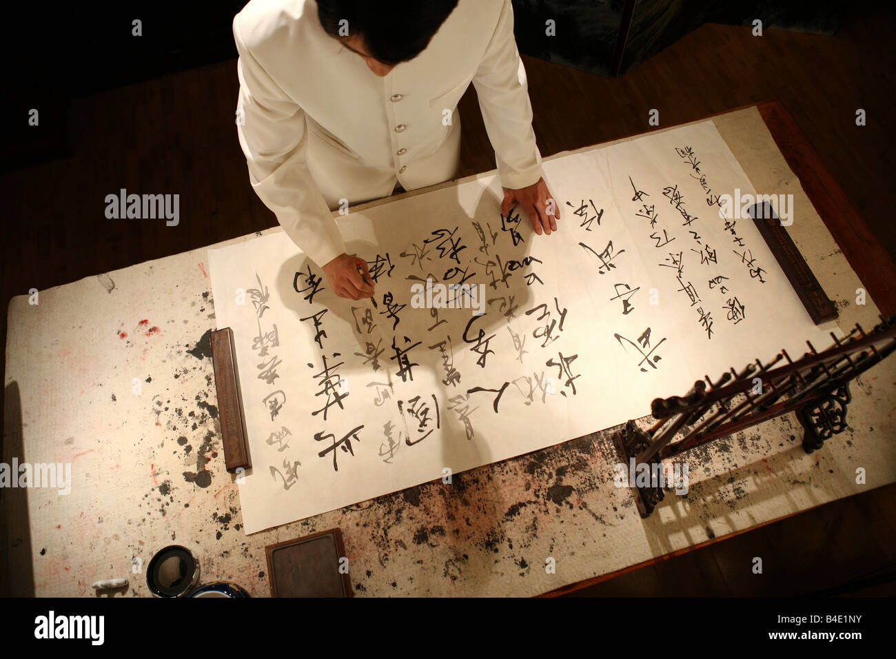 Chinese Man Practising Calligraphy Stock Photo - Alamy