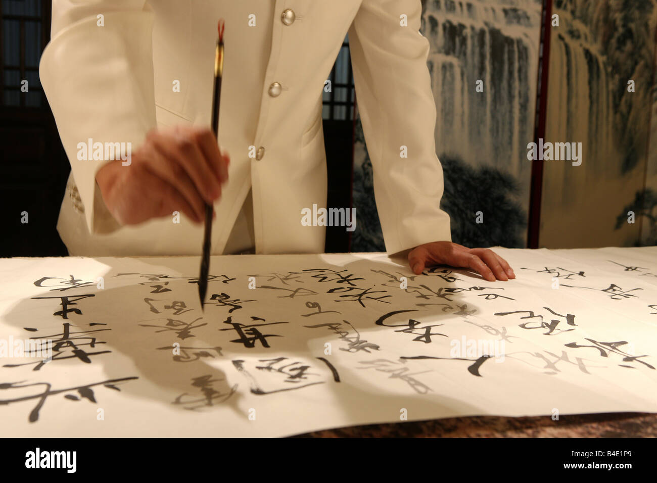 Chinese Man Practising Calligraphy Stock Photo - Alamy