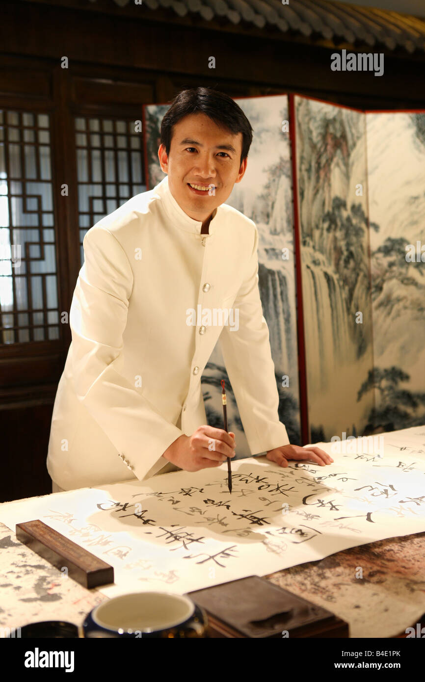 Chinese Man Practising Calligraphy Stock Photo - Alamy