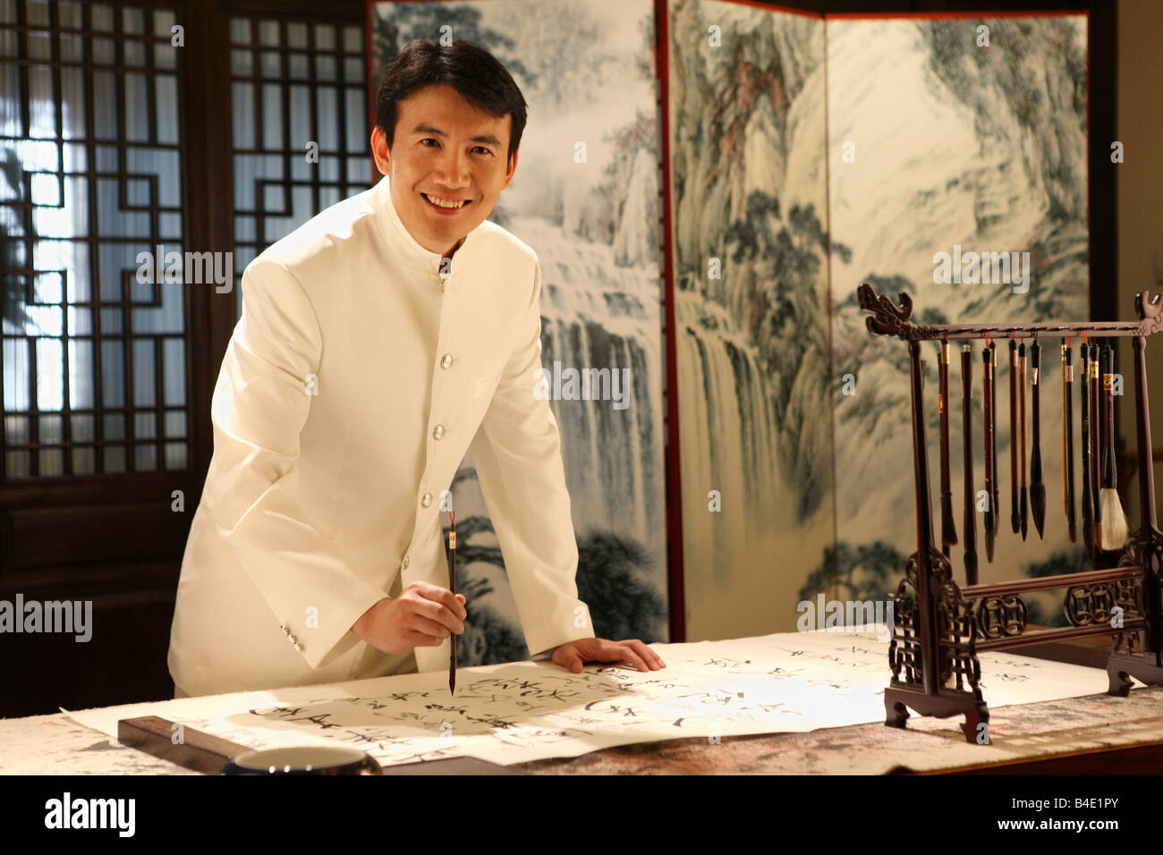 Chinese Man Practising Calligraphy Stock Photo - Alamy