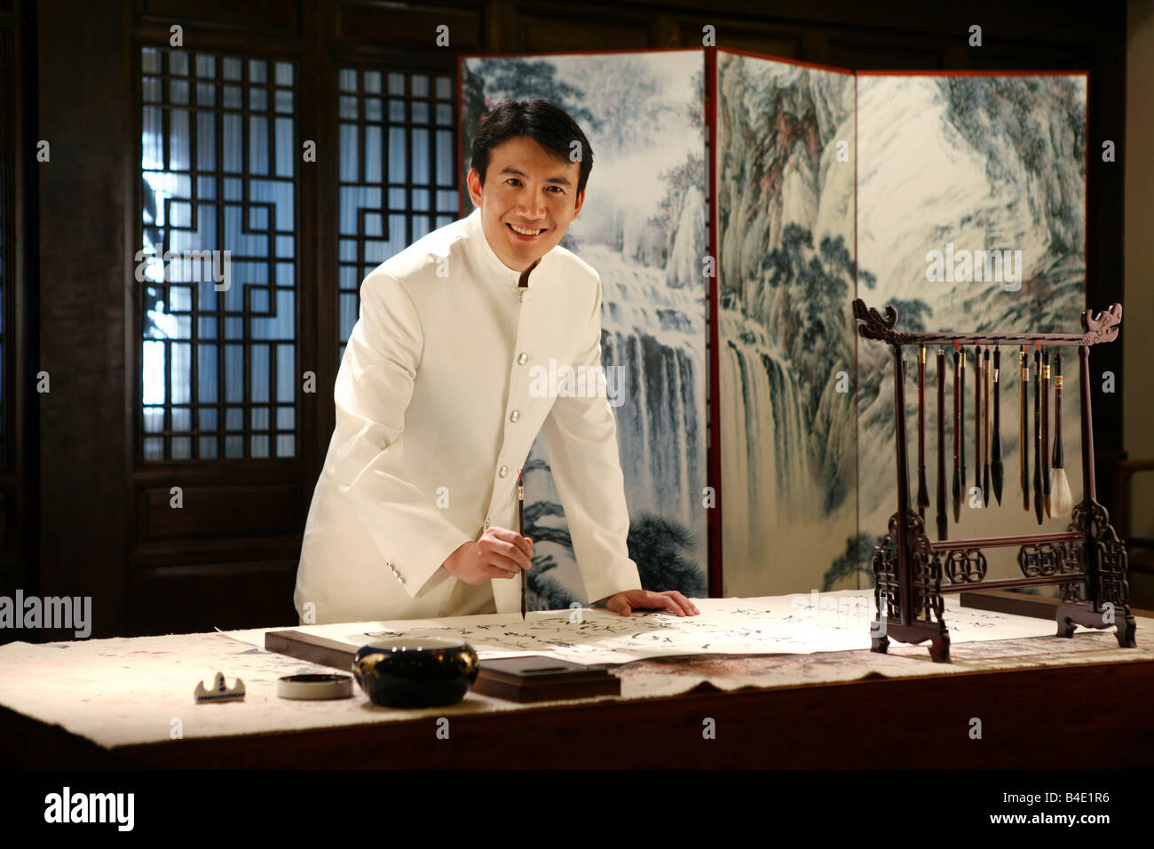 Chinese Man Practising Calligraphy Stock Photo - Alamy