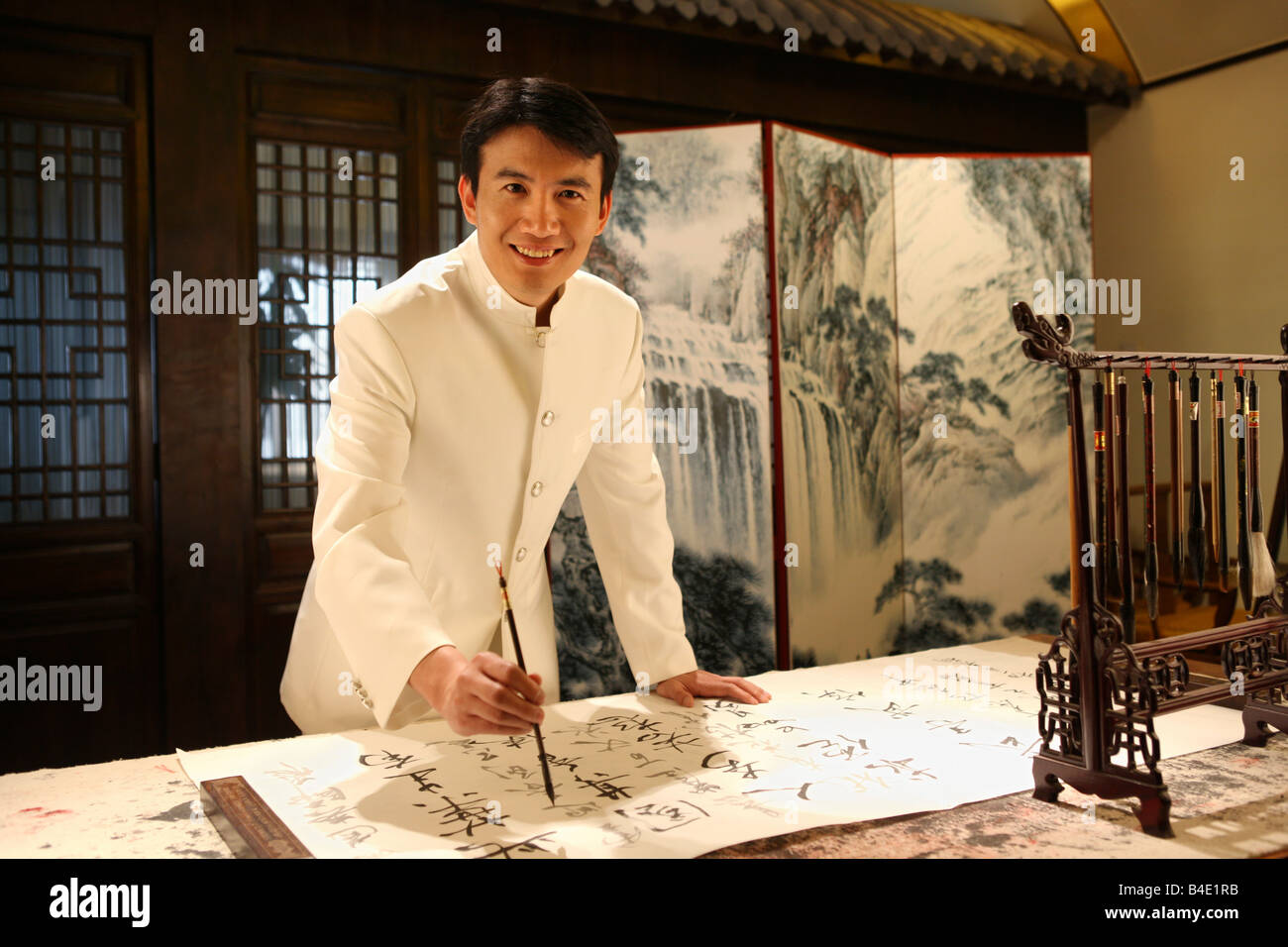 Chinese Man Practising Calligraphy Stock Photo - Alamy