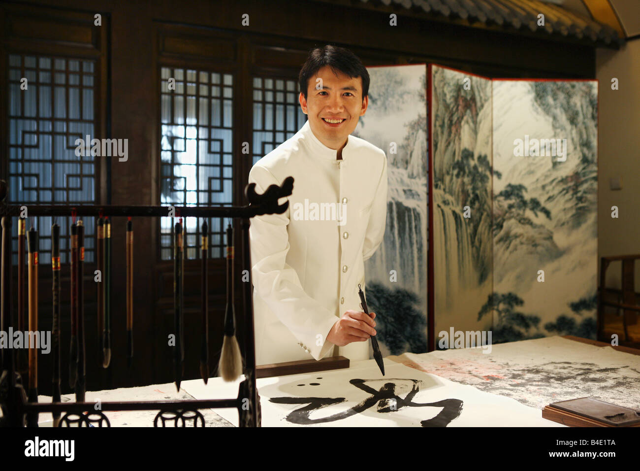 Chinese Man Practising Calligraphy Stock Photo - Alamy