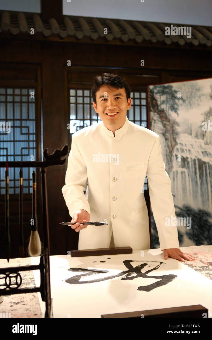 Chinese Man Practising Calligraphy Stock Photo - Alamy