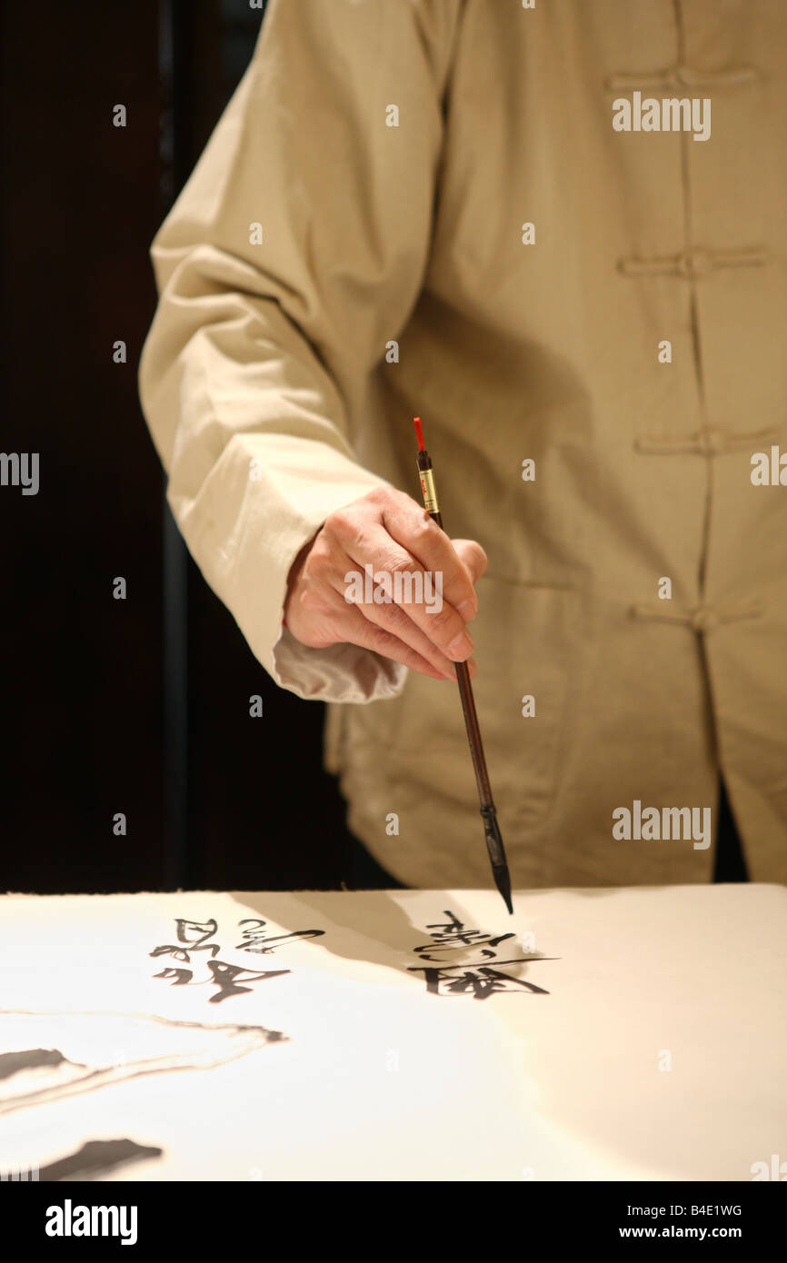 Chinese Man Practising Calligraphy Stock Photo - Alamy