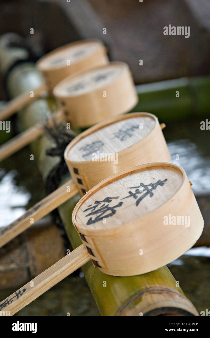 Wooden ladles for temizu at a bamboo water reservoir in Kyoto Japan ...