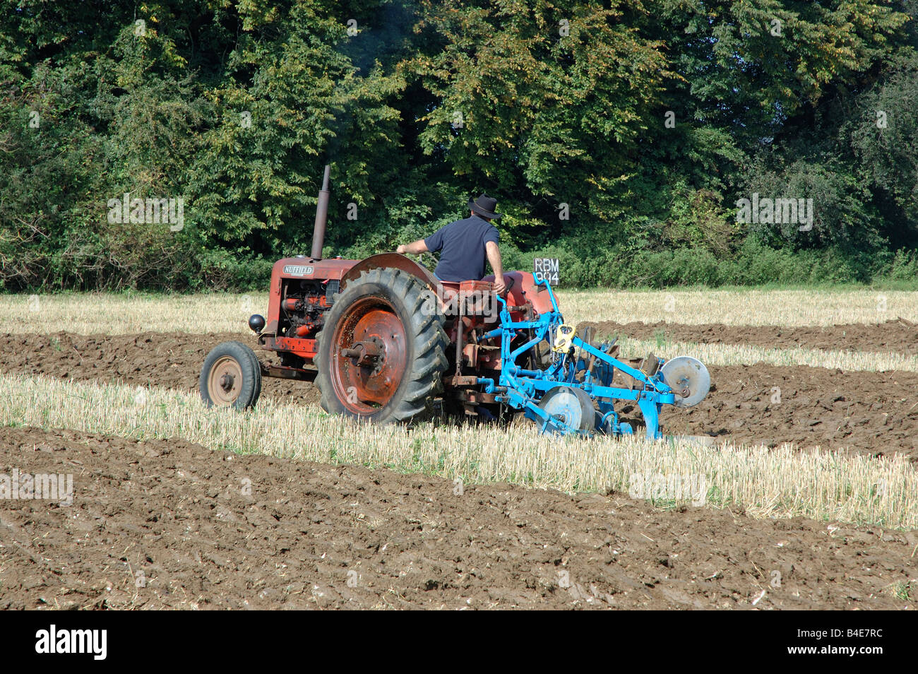 Tractor in a field Stock Photo - Alamy