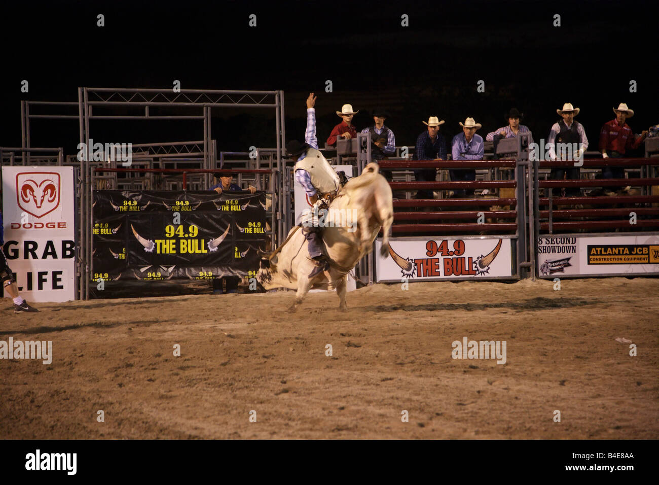 Professional Bull Rider (PBR) riding a bull. Rockdale County Fair ...
