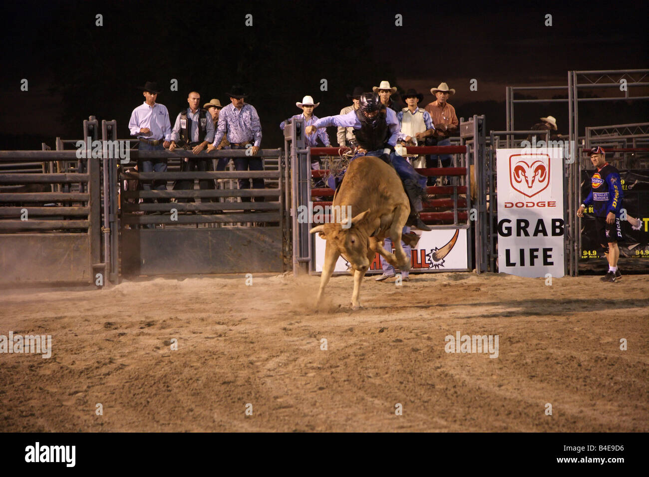 Professional Bull Rider (PBR) riding a bull. Rockdale County Fair ...