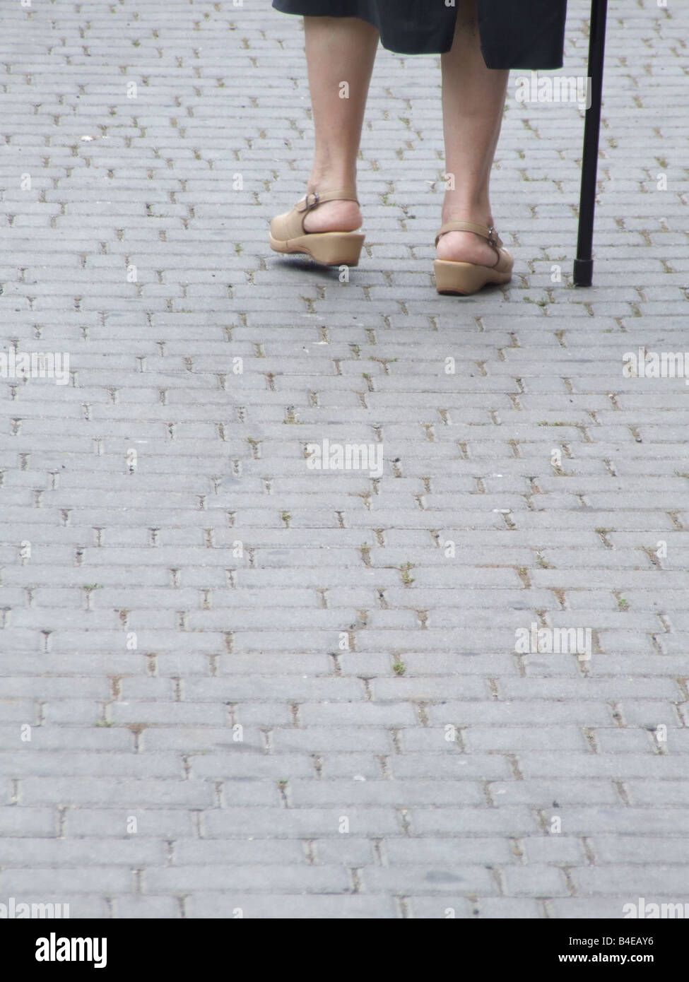 one person walking in street in city town Stock Photo - Alamy