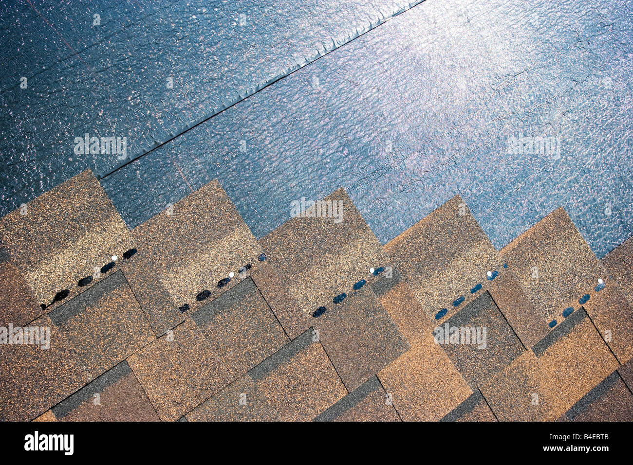 new shingles being installed over rubber membrane on roof Stock Photo ...