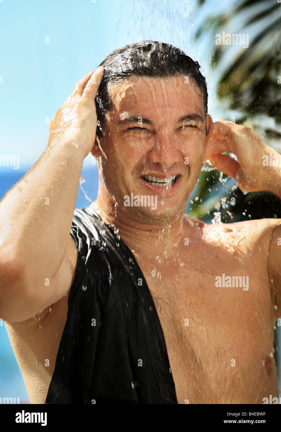 Handsome happy man is taking an outdoor shower Stock Photo - Alamy