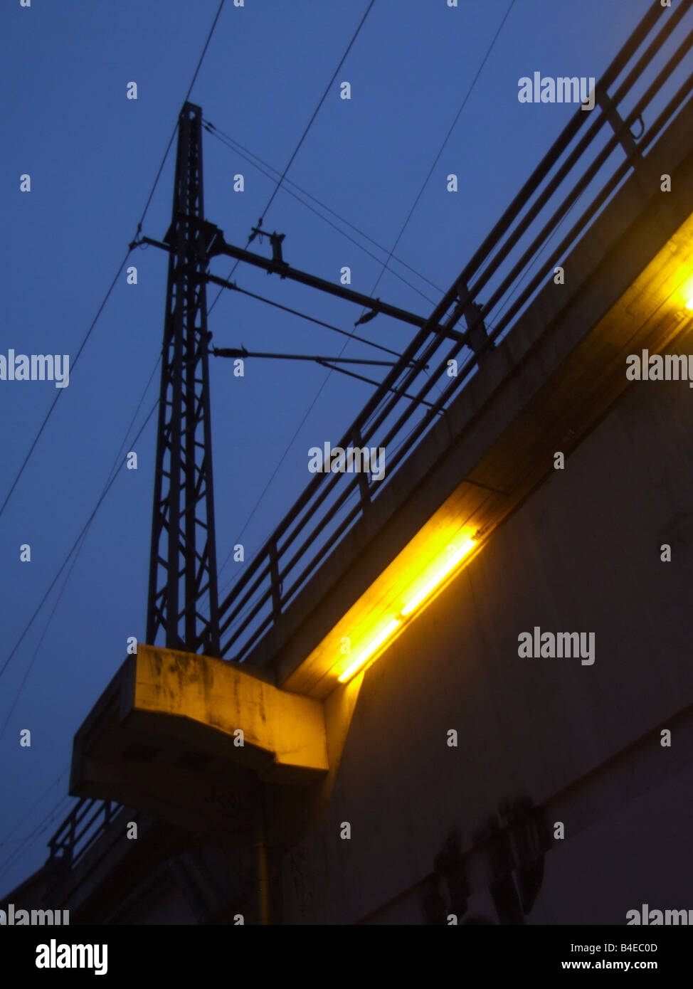 detail of illuminated train bridge in city at night Stock Photo - Alamy