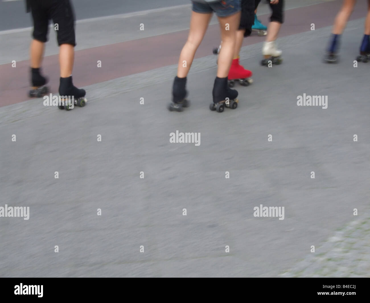 roller skaters in street in city town Stock Photo - Alamy